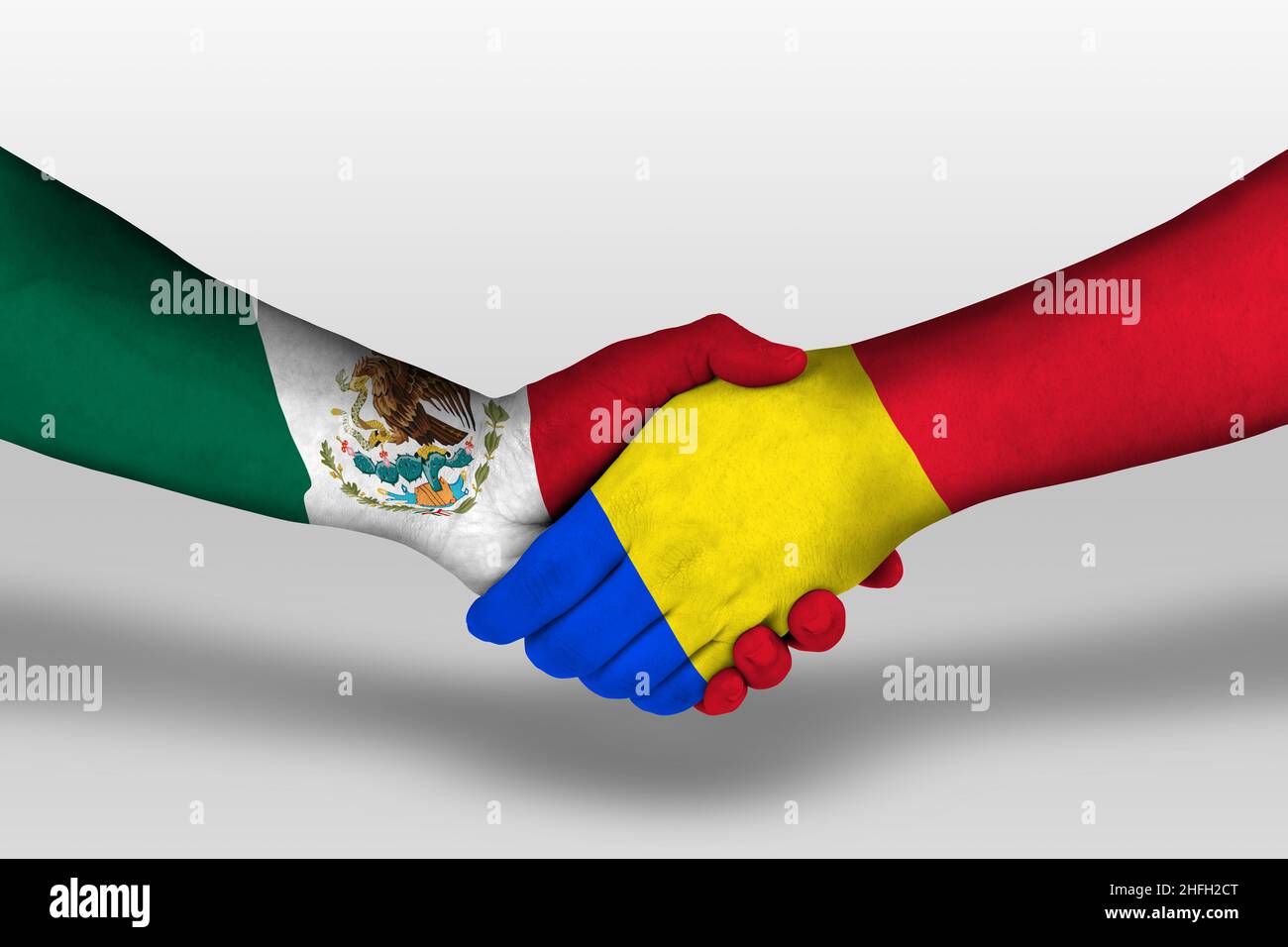 Handshake between romania and mexico flags painted on hands ...