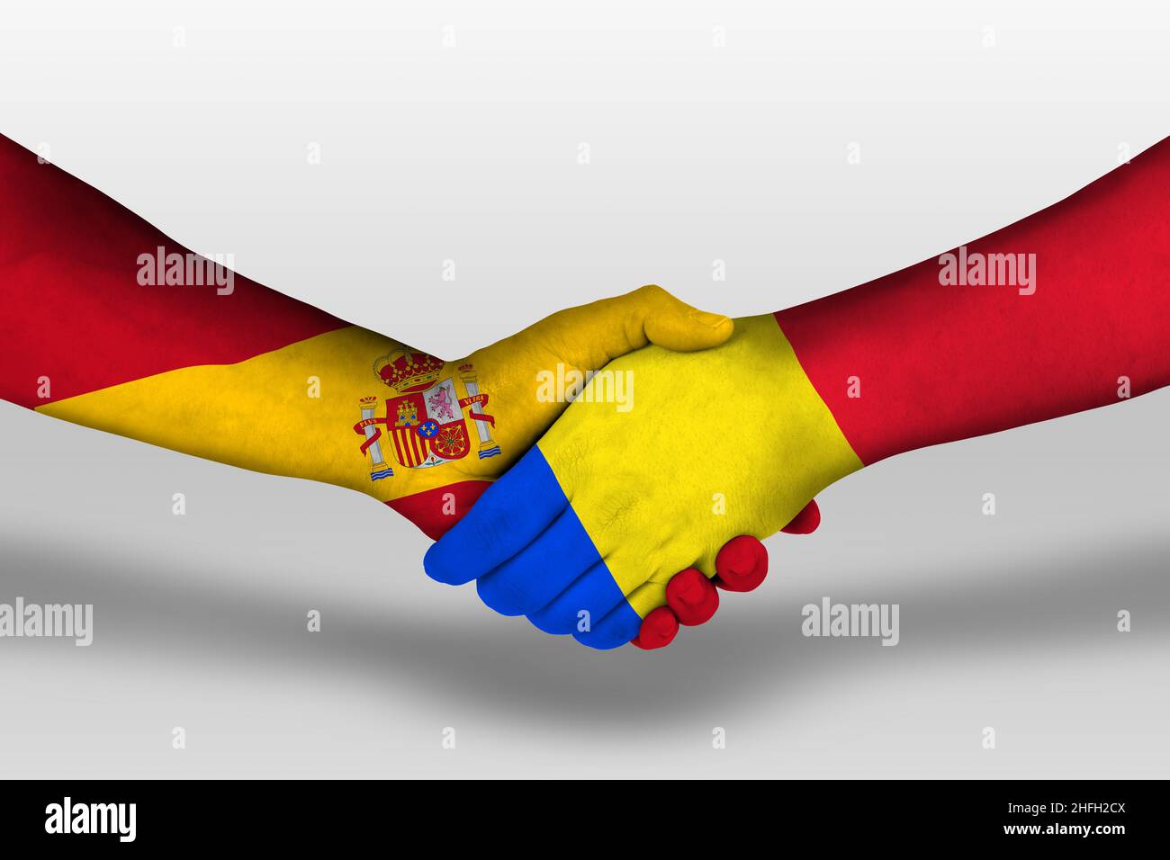 Handshake between romania and spain flags painted on hands ...