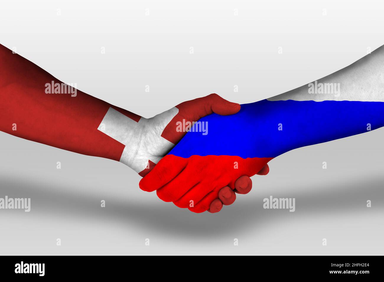 Handshake between russia and switzerland flags painted on hands ...