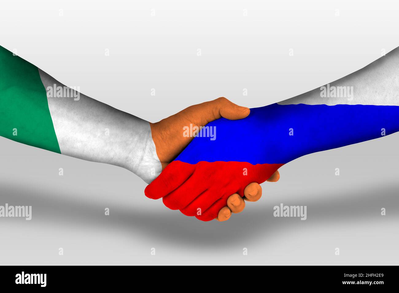 Handshake between russia and ireland flags painted on hands ...