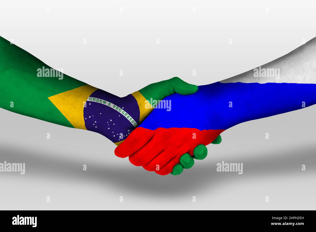 Handshake between russia and brazil flags painted on hands ...