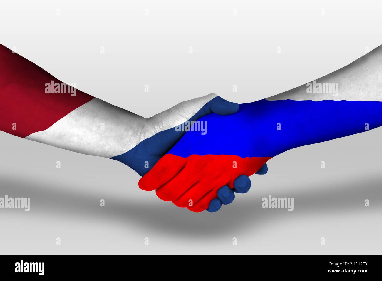 Handshake between russia and netherlands flags painted on hands ...