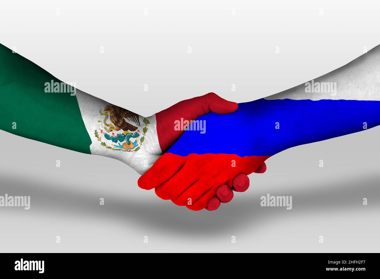 Handshake between russia and mexico flags painted on hands ...