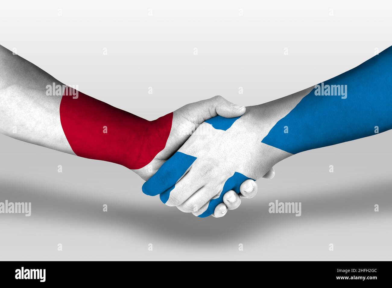 Handshake between scotland and japan flags painted on hands ...