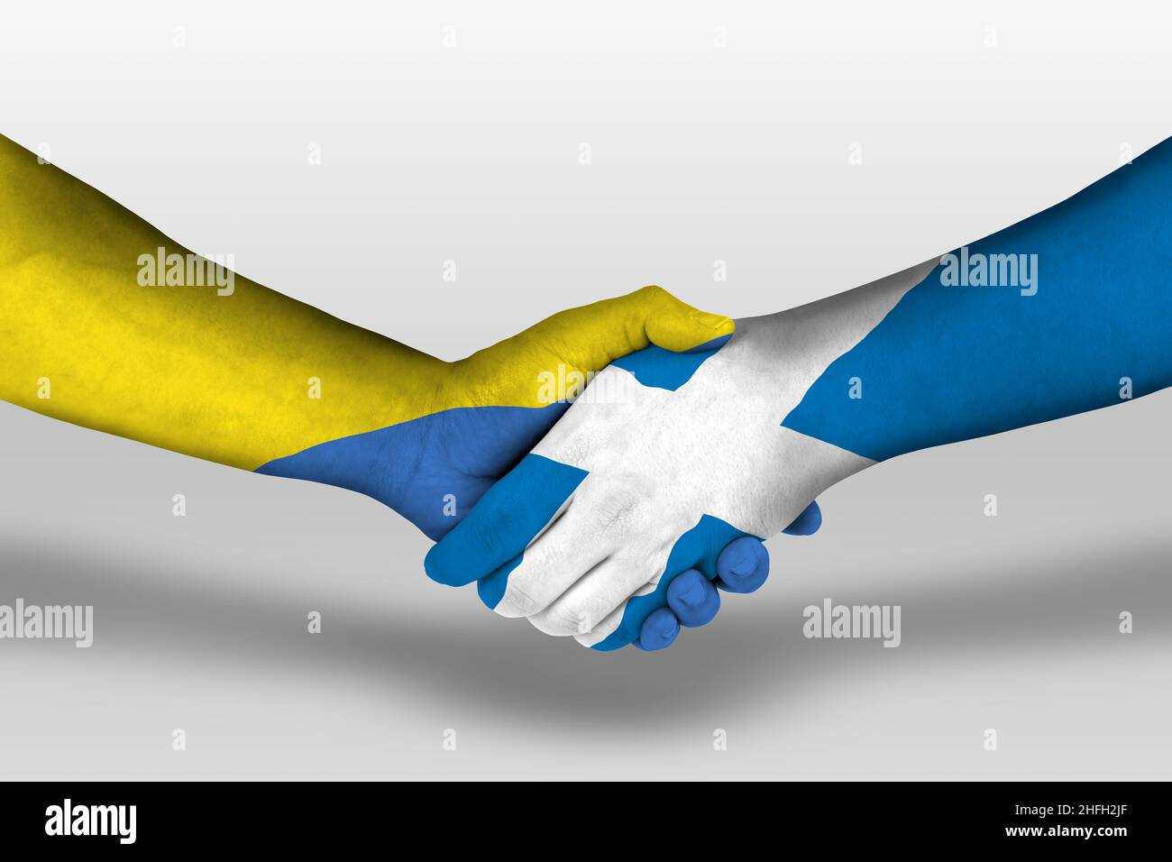 Handshake between scotland and ukraine flags painted on hands ...