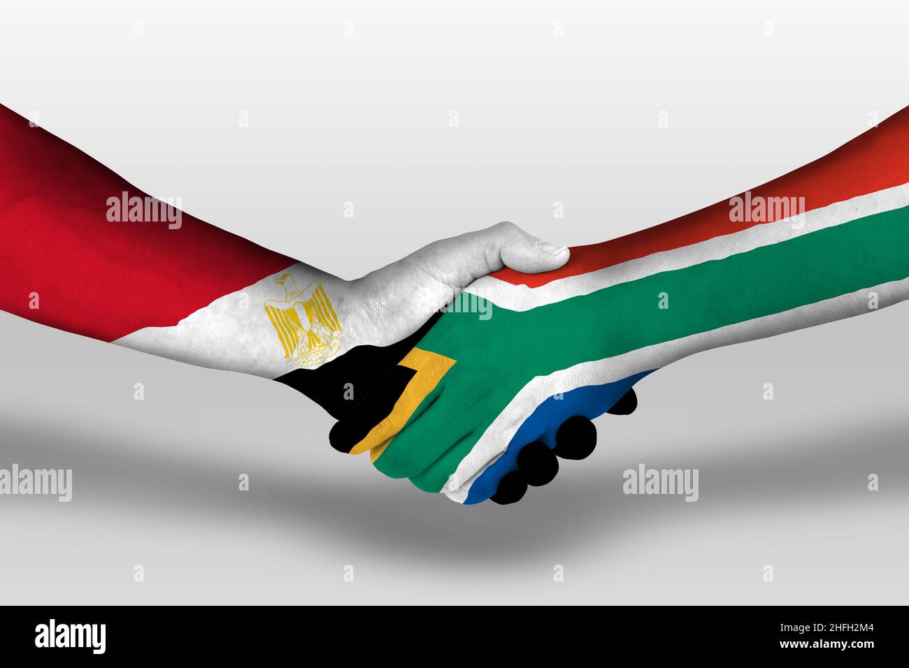 Handshake between south africa and egypt flags painted on hands ...