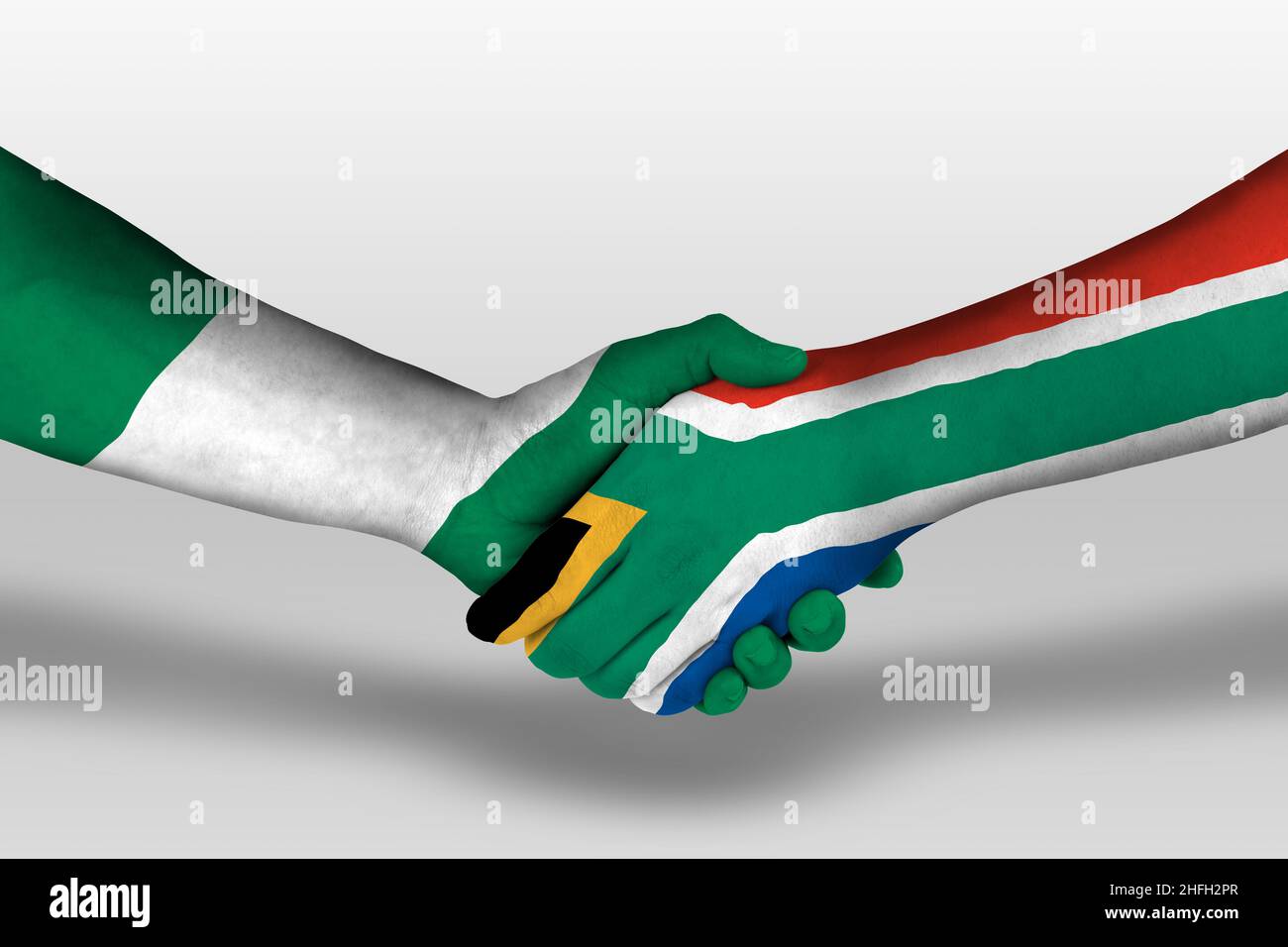 Handshake between south africa and nigeria flags painted on hands ...