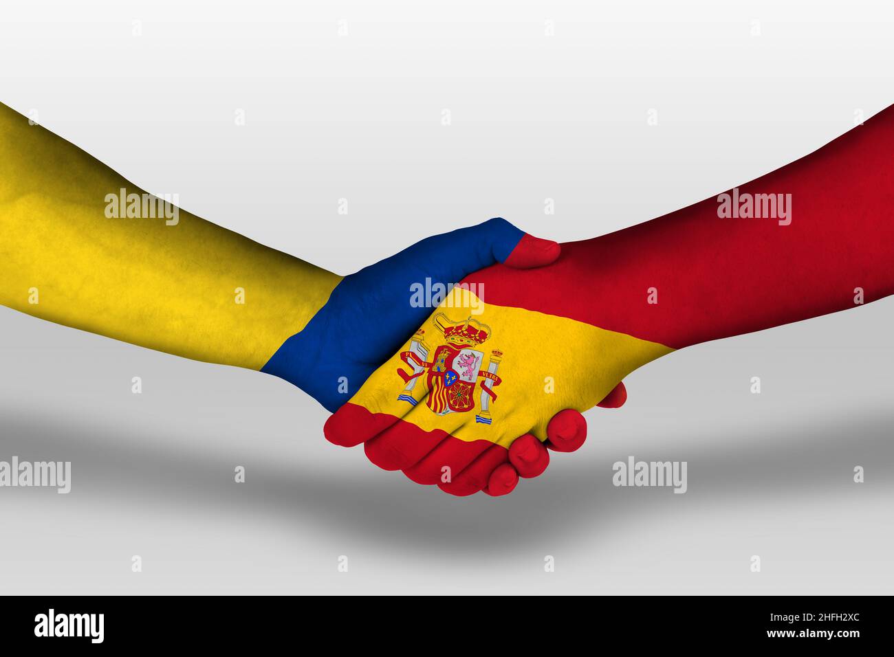 Handshake between spain and columbia flags painted on hands ...