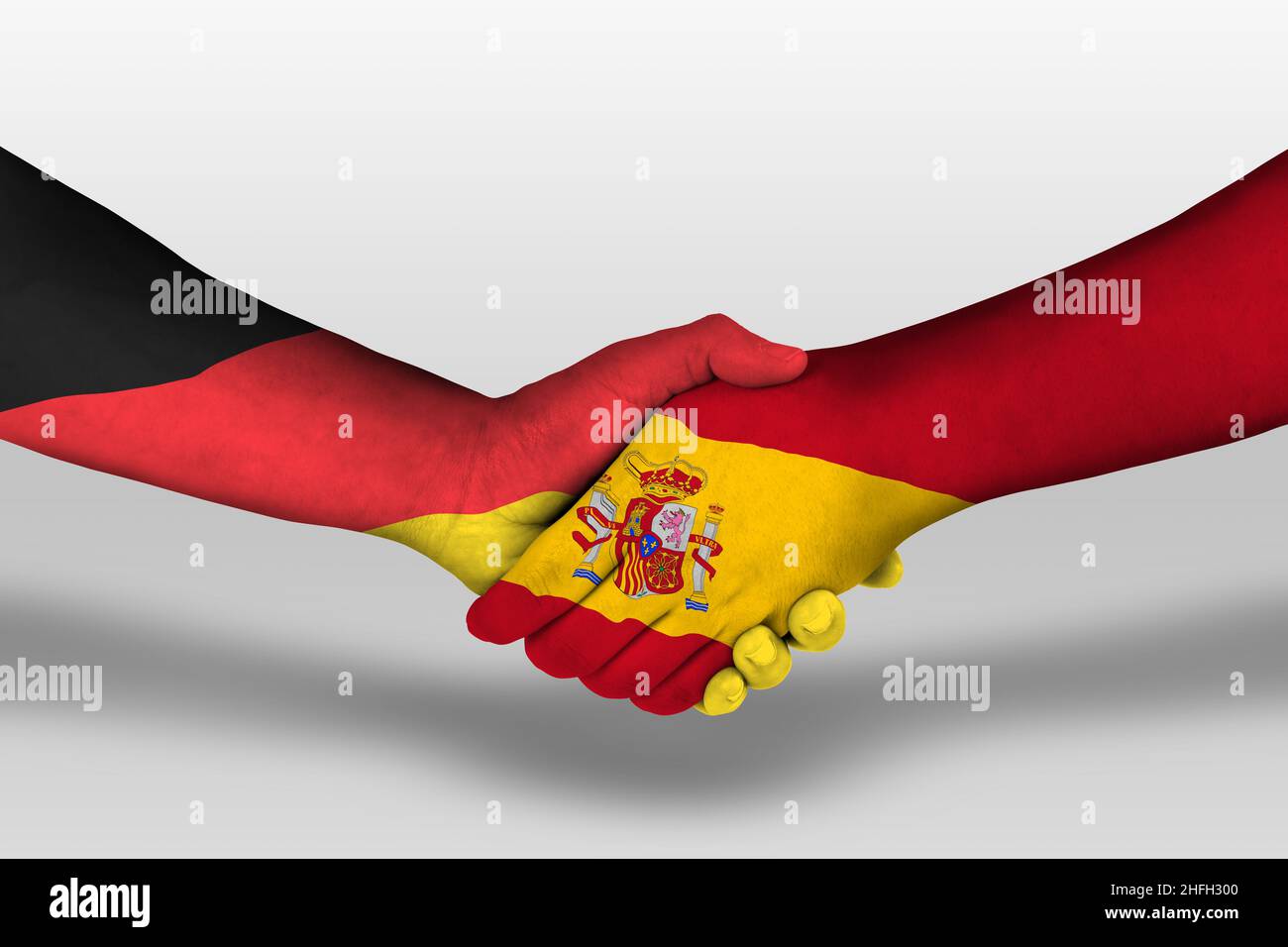 Handshake between spain and germany flags painted on hands ...