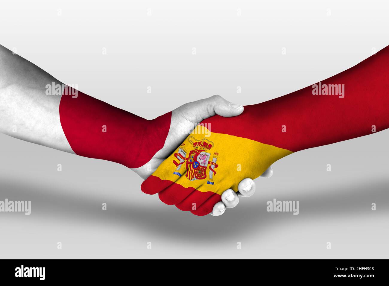 Handshake between spain and japan flags painted on hands, illustration ...