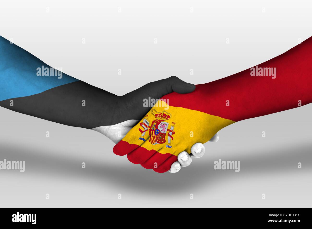 Handshake between spain and estonia flags painted on hands ...