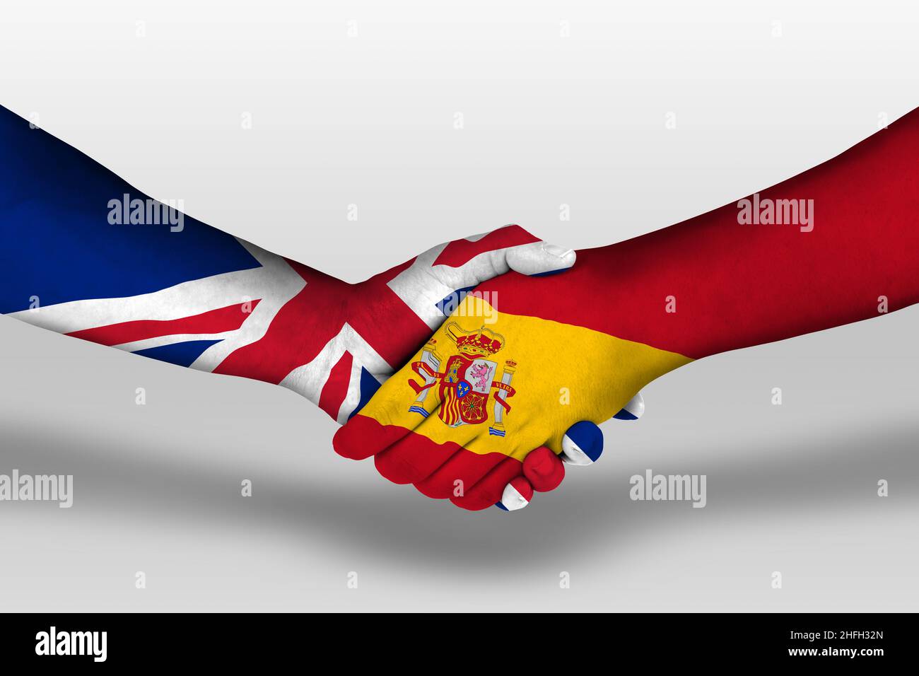 Handshake between spain and united kingdom flags painted on hands ...