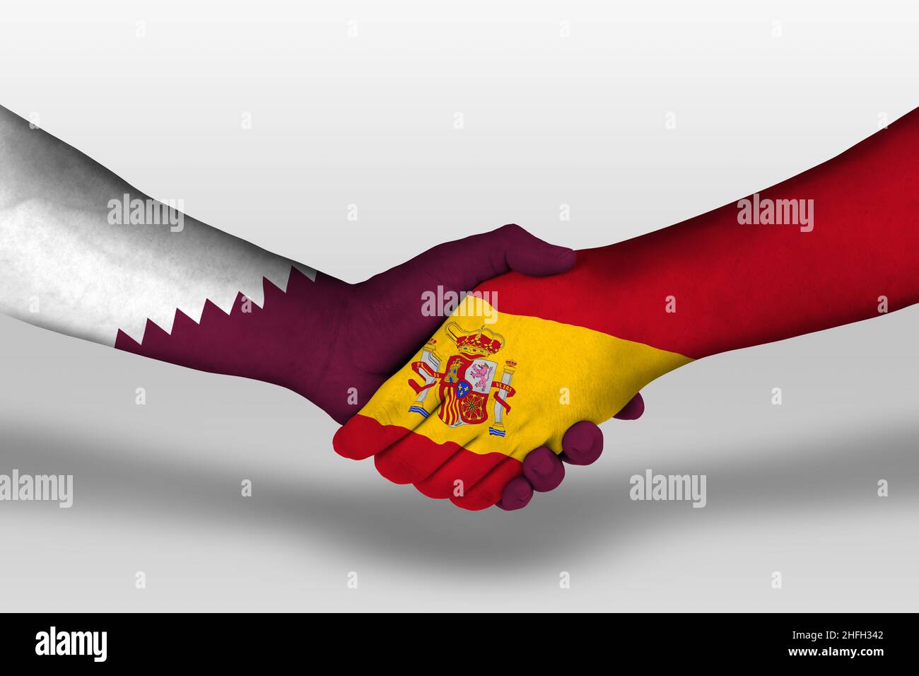 Handshake between spain and qatar flags painted on hands, illustration ...