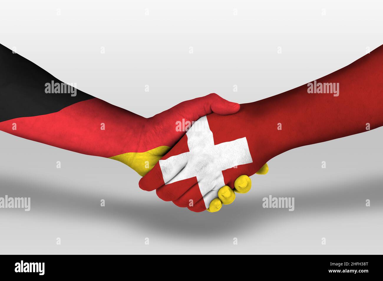 Handshake between switzerland and germany flags painted on hands ...