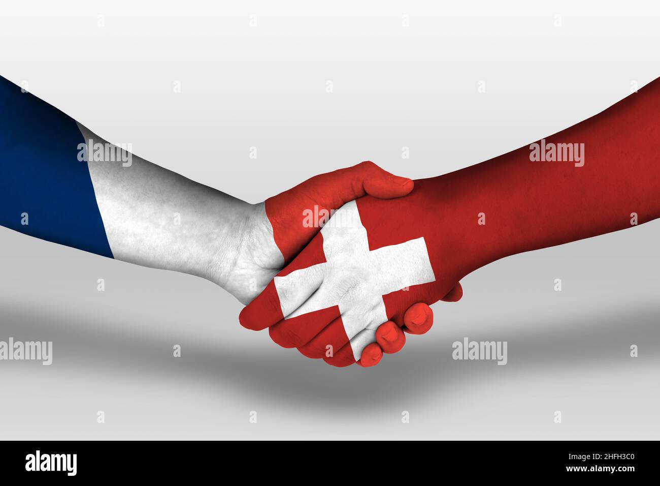Handshake between switzerland and france flags painted on hands ...