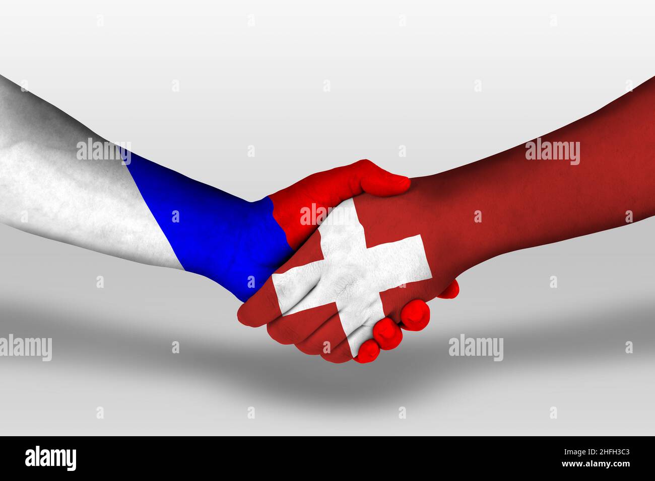 Handshake between switzerland and russia flags painted on hands ...