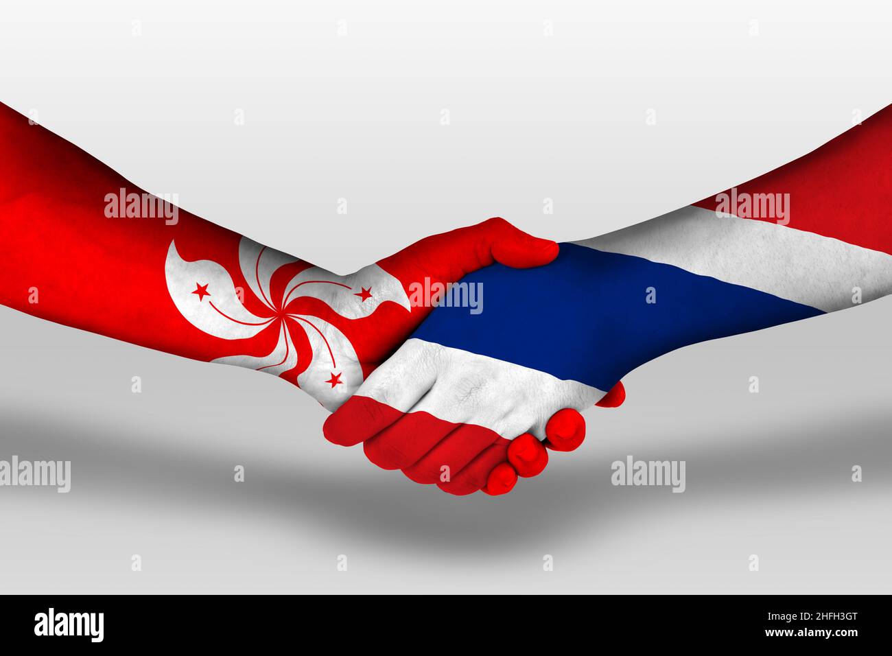 Handshake between thailand and hong kong flags painted on hands ...