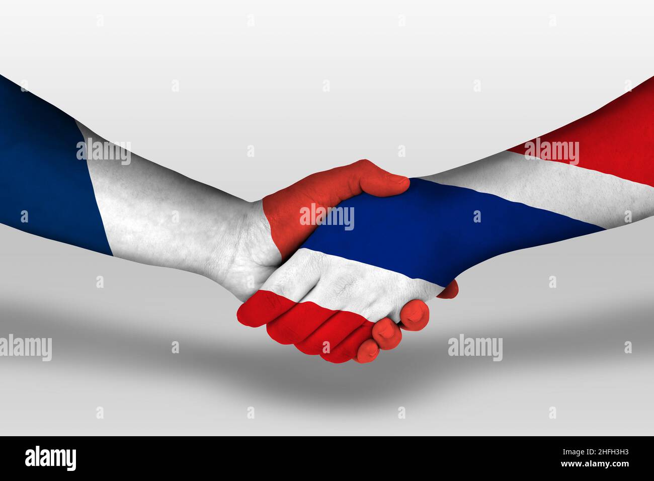 Handshake between thailand and france flags painted on hands ...
