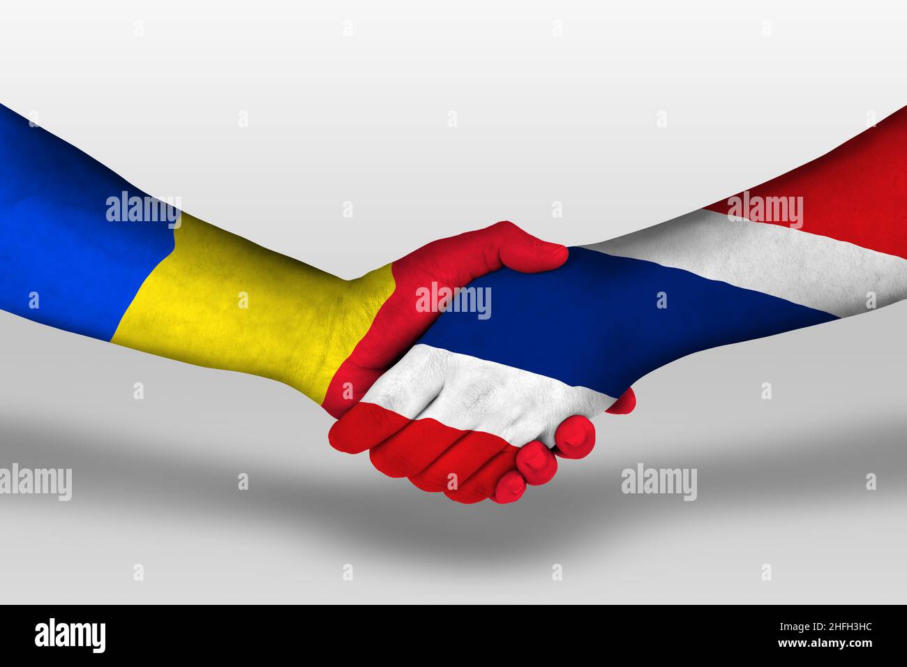 Handshake between thailand and romania flags painted on hands ...