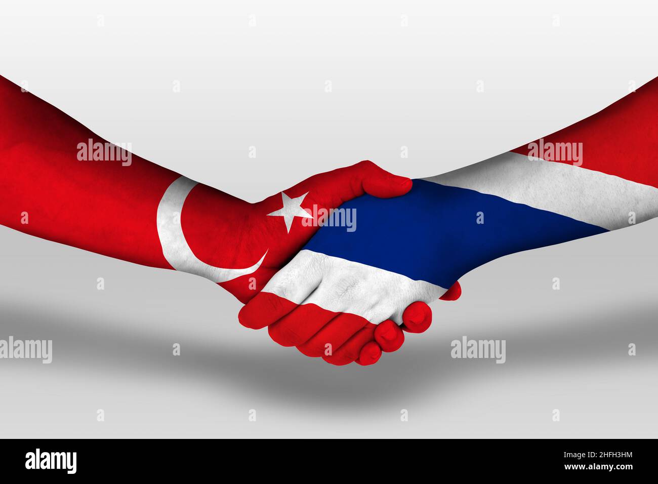 Handshake between thailand and turkey flags painted on hands ...