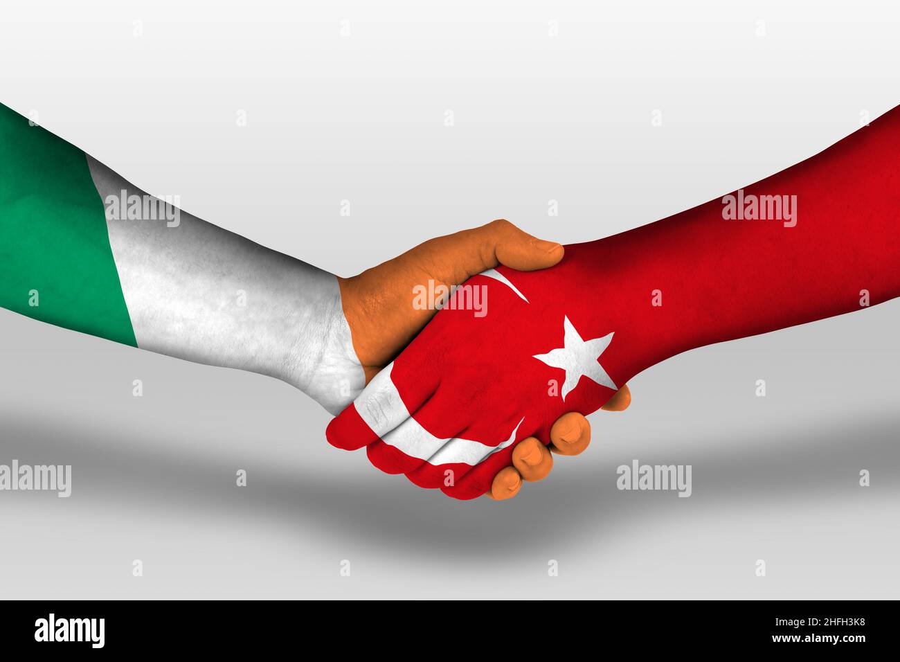 Handshake between turkey and ireland flags painted on hands ...
