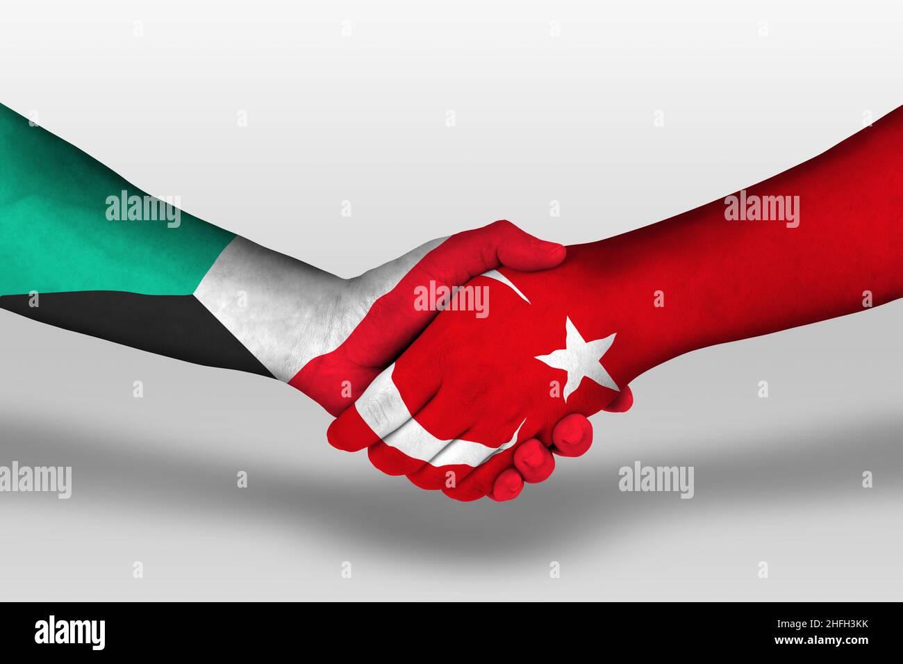 Handshake between turkey and kuwait flags painted on hands ...