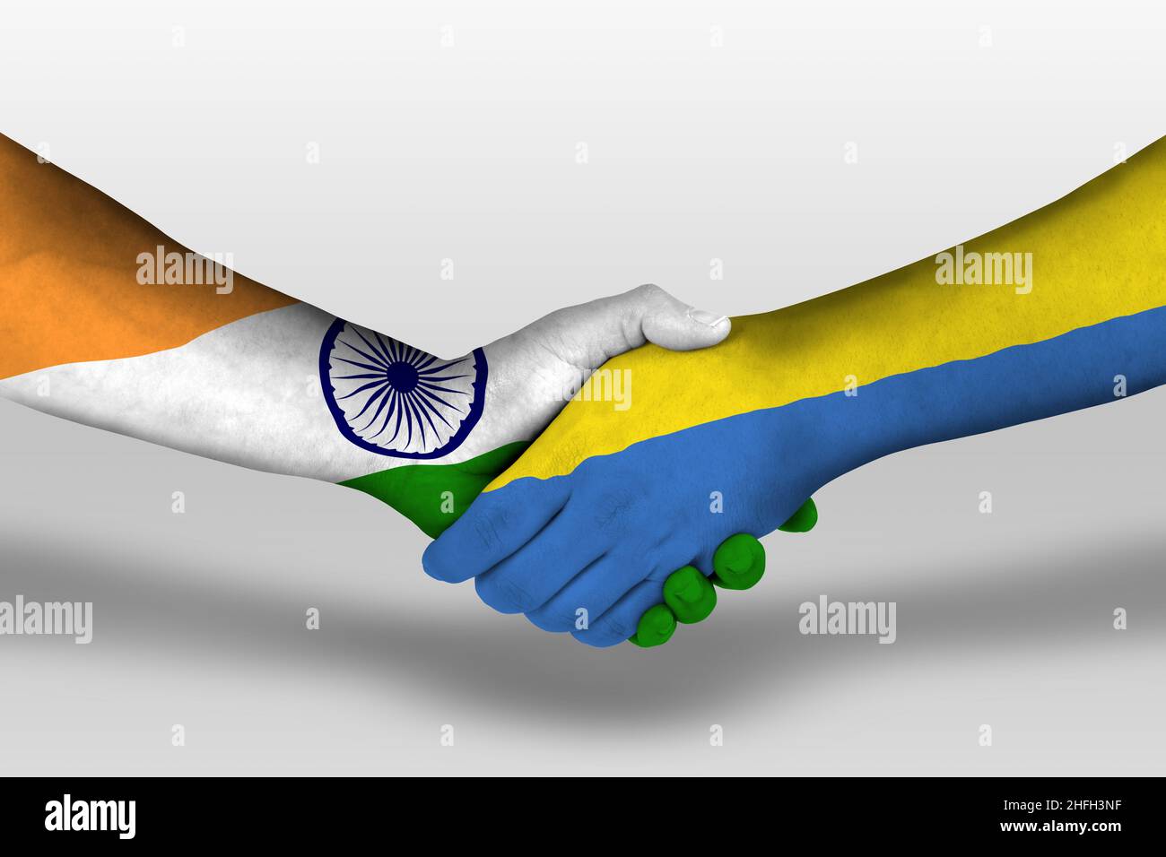 Handshake between ukraine and india flags painted on hands ...