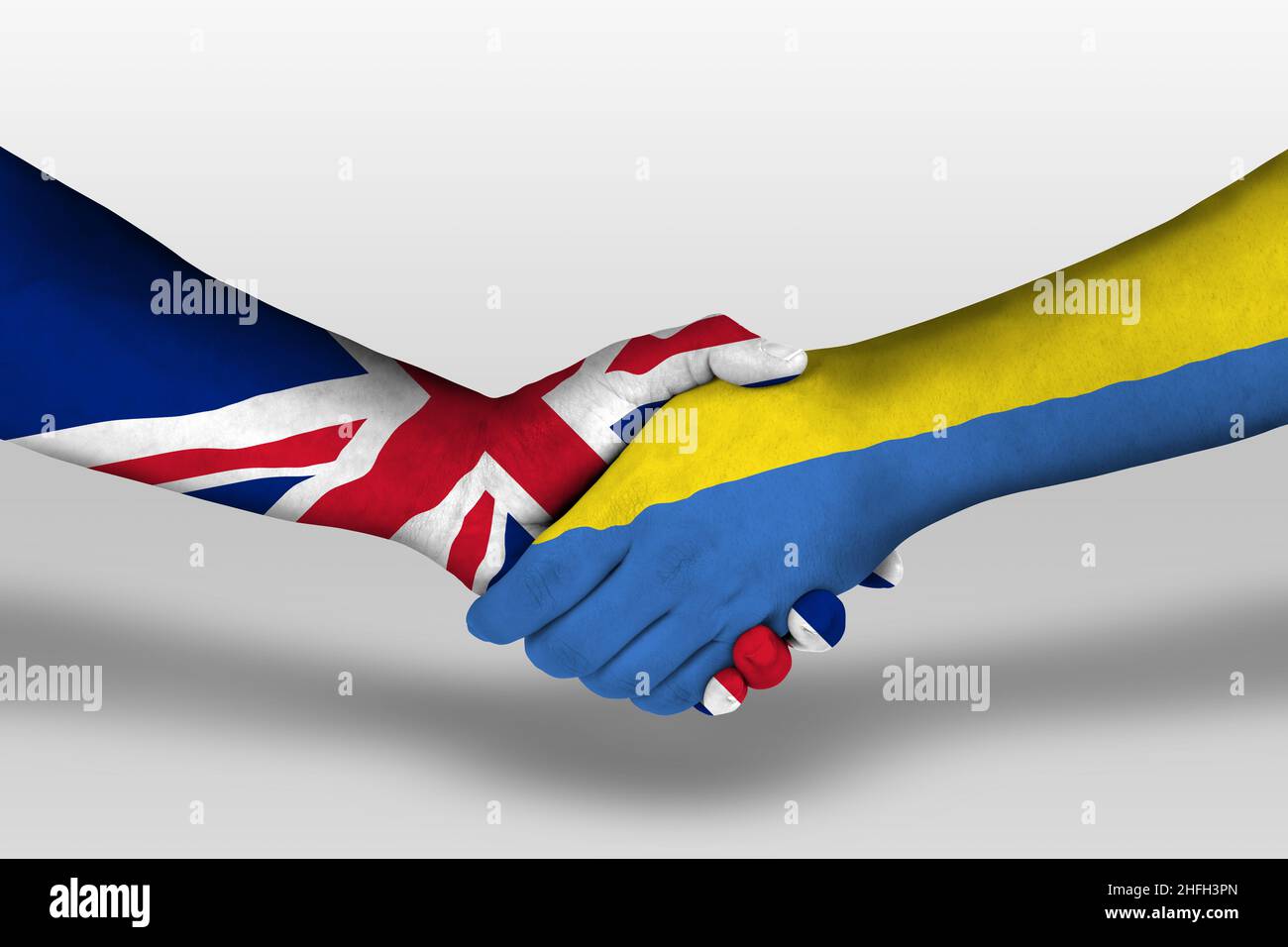 Handshake between ukraine and united kingdom flags painted on hands ...