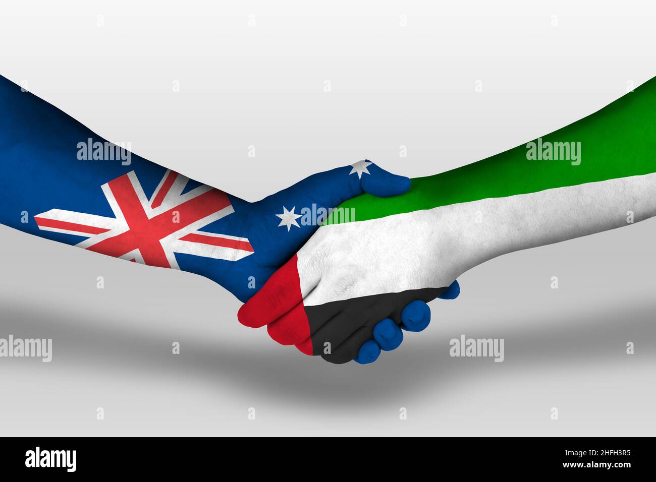 Handshake between united arab emirates and australia flags painted on ...