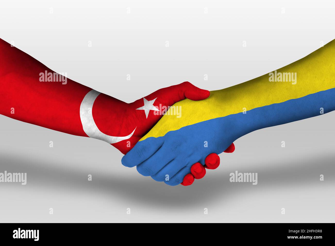 Handshake between ukraine and turkey flags painted on hands ...