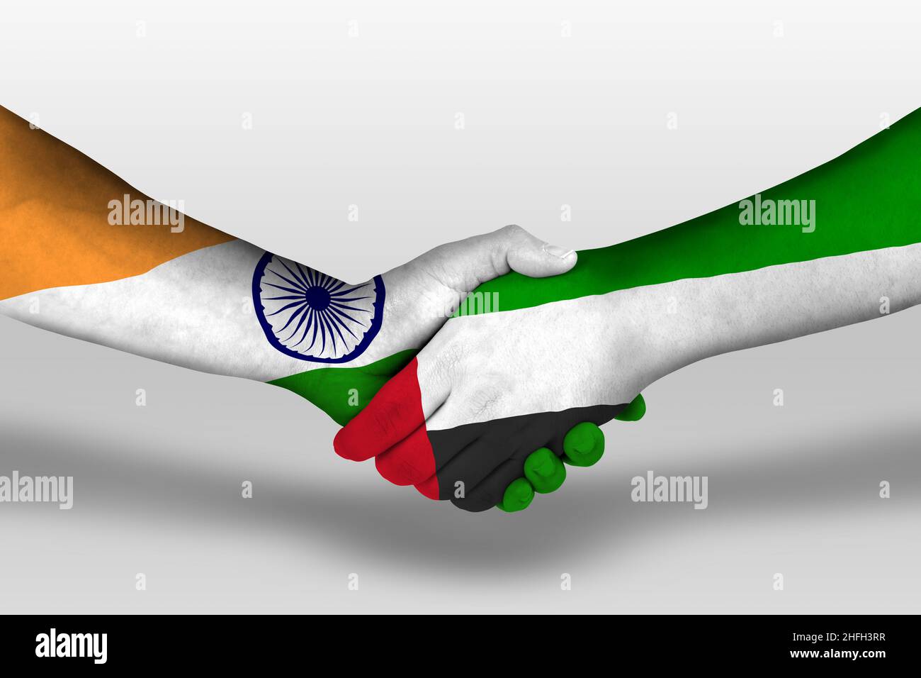 Handshake between united arab emirates and india flags painted on hands ...