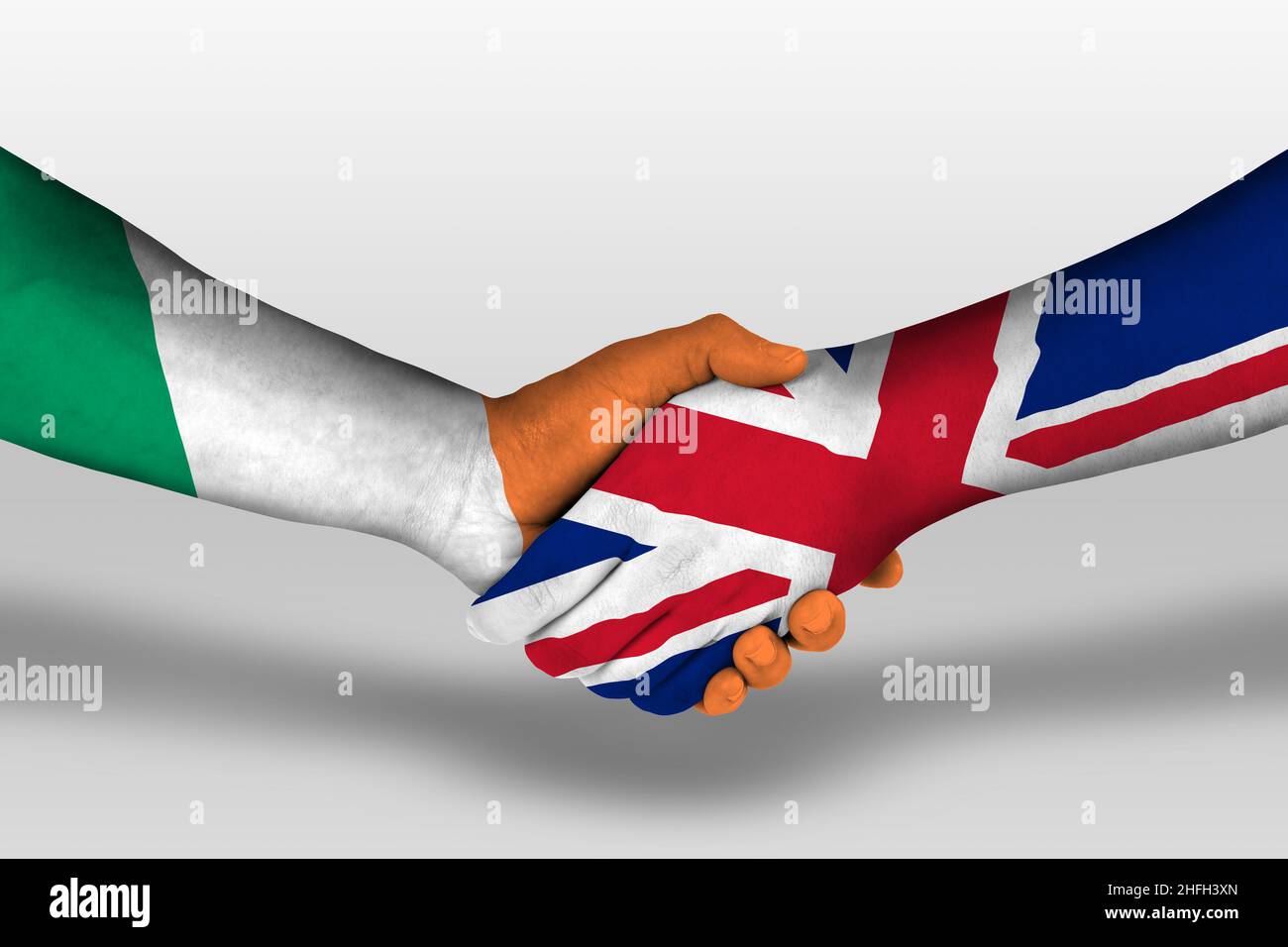 Handshake between united kingdom and ireland flags painted on hands ...