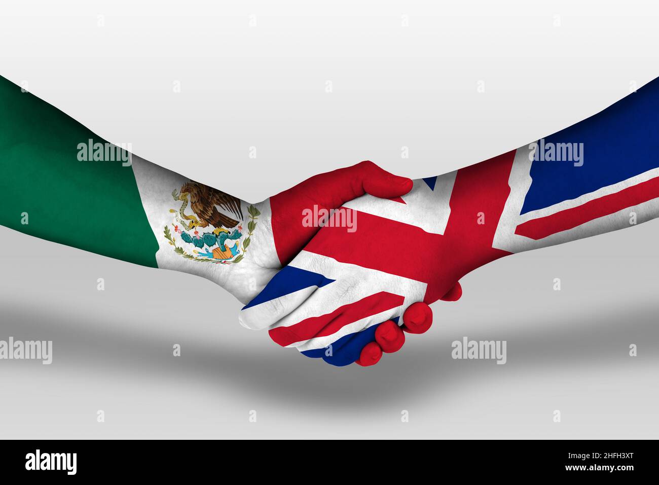 Handshake between united kingdom and mexico flags painted on hands ...
