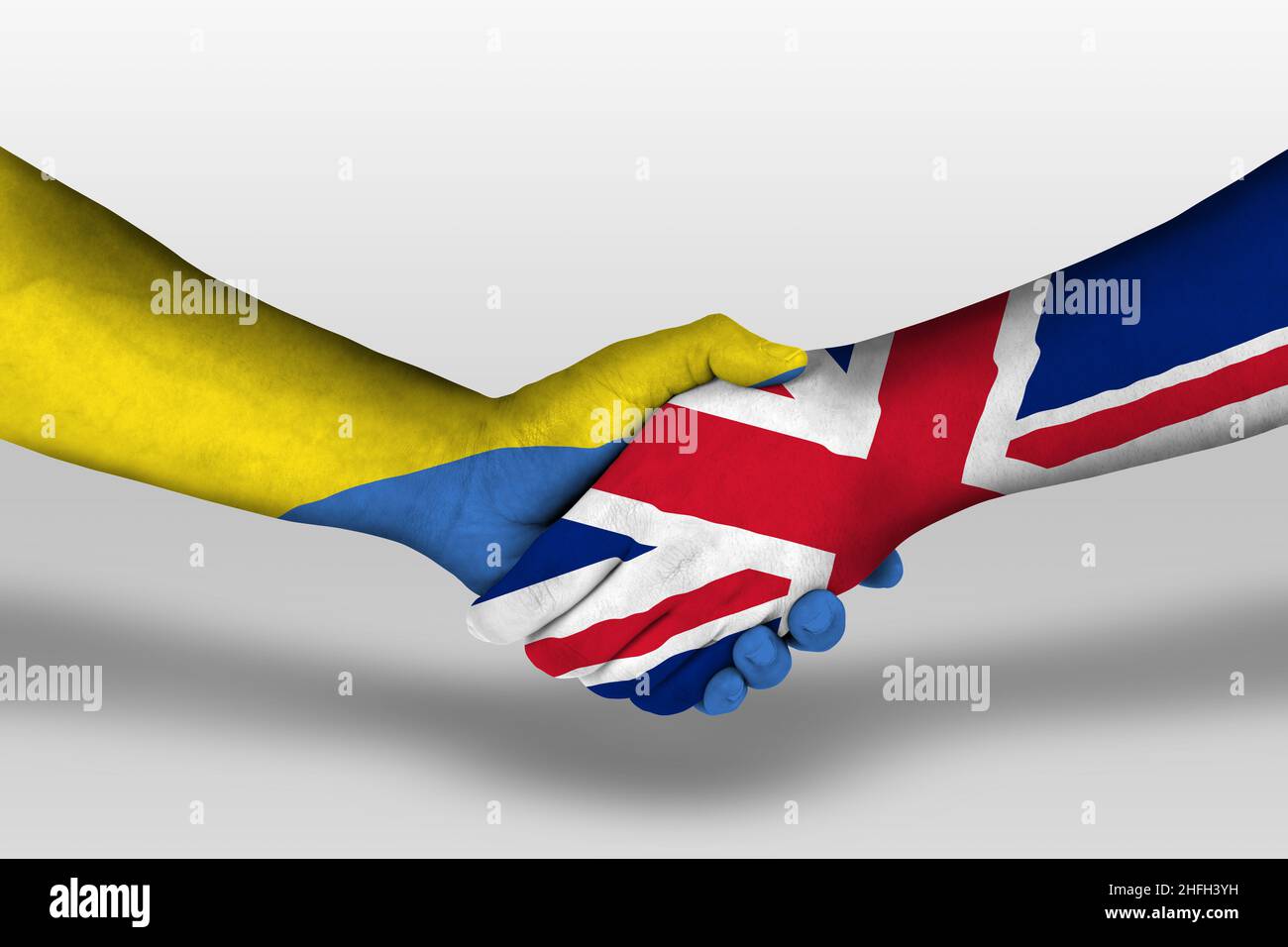 Handshake between united kingdom and ukraine flags painted on hands ...