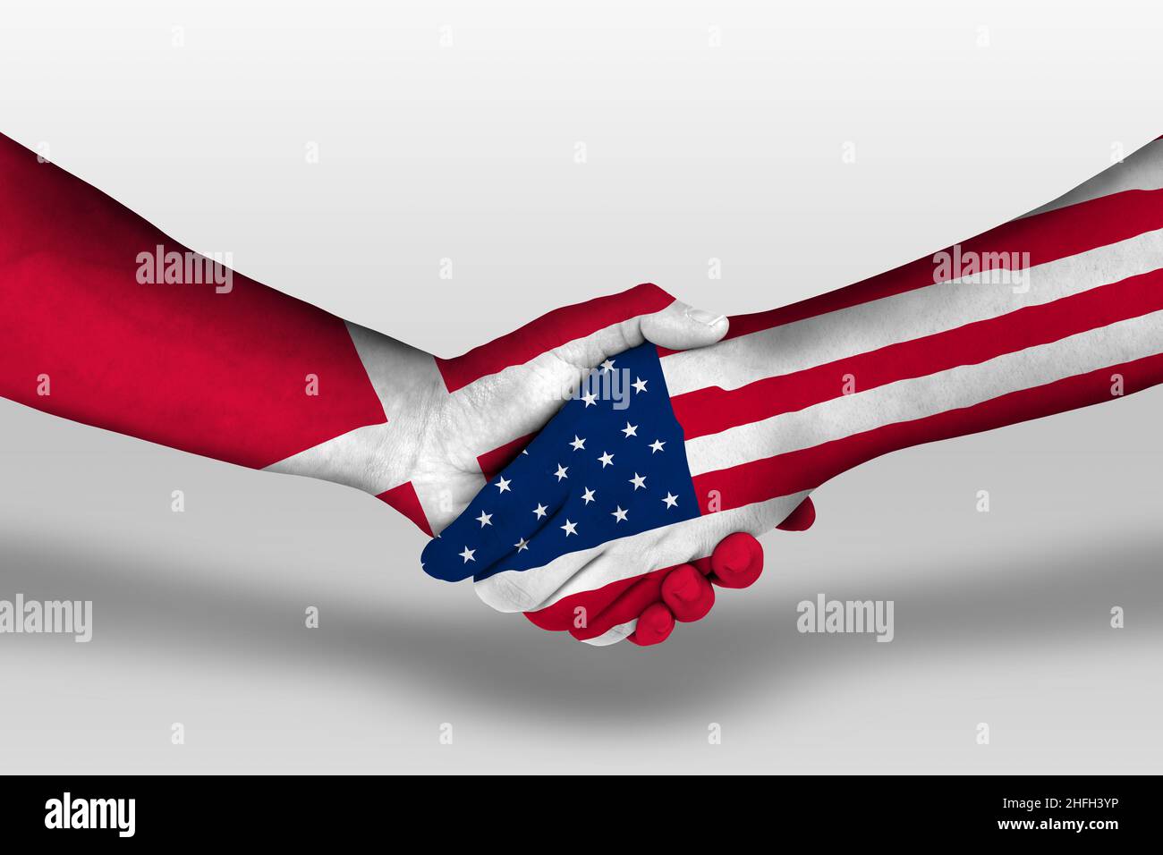 Handshake between united states of america and denmark flags painted on ...
