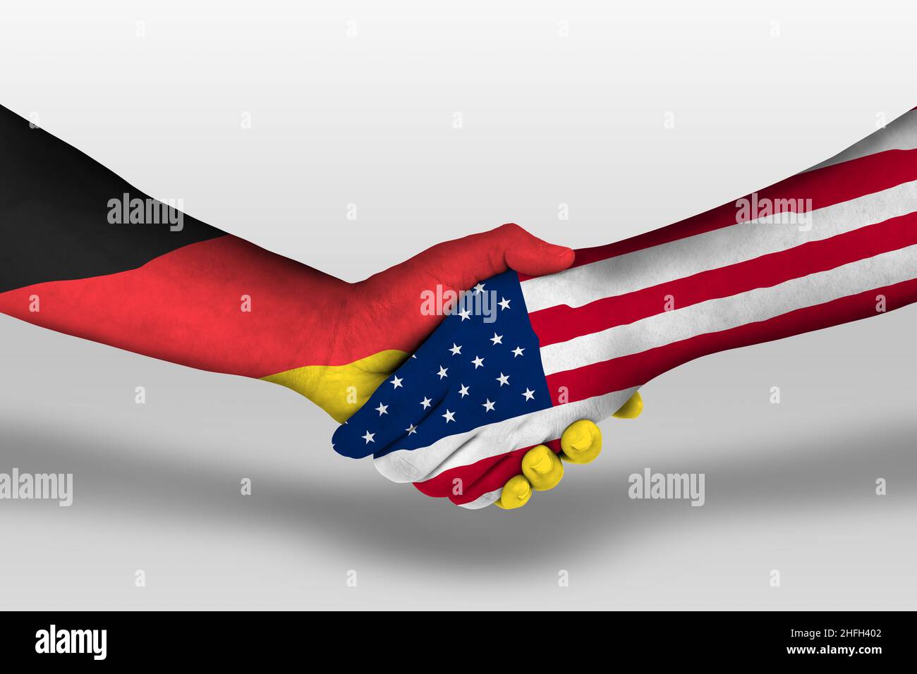 Handshake between united states of america and germany flags painted on ...