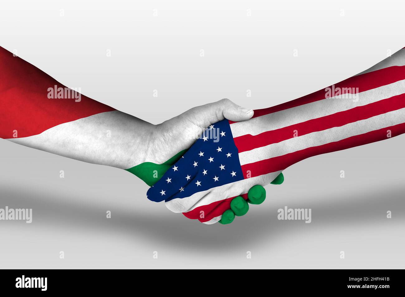Handshake between united states of america and hungary flags painted on ...