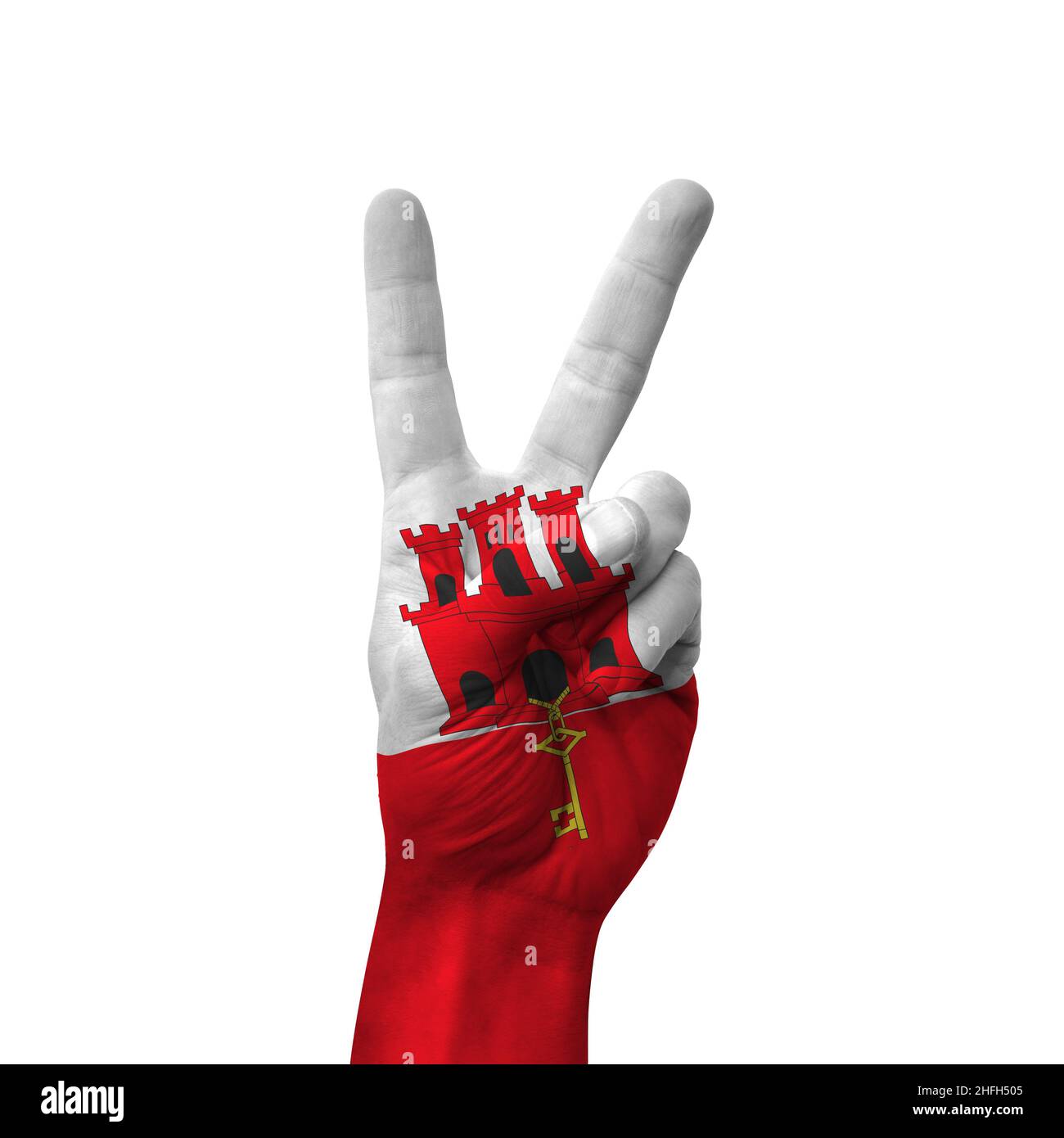 Hand making victory sign, gibraltar painted with flag as symbol of ...