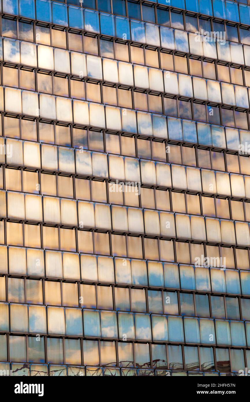 reflection of sky and clouds in a facade of a skyscraper Stock Photo ...