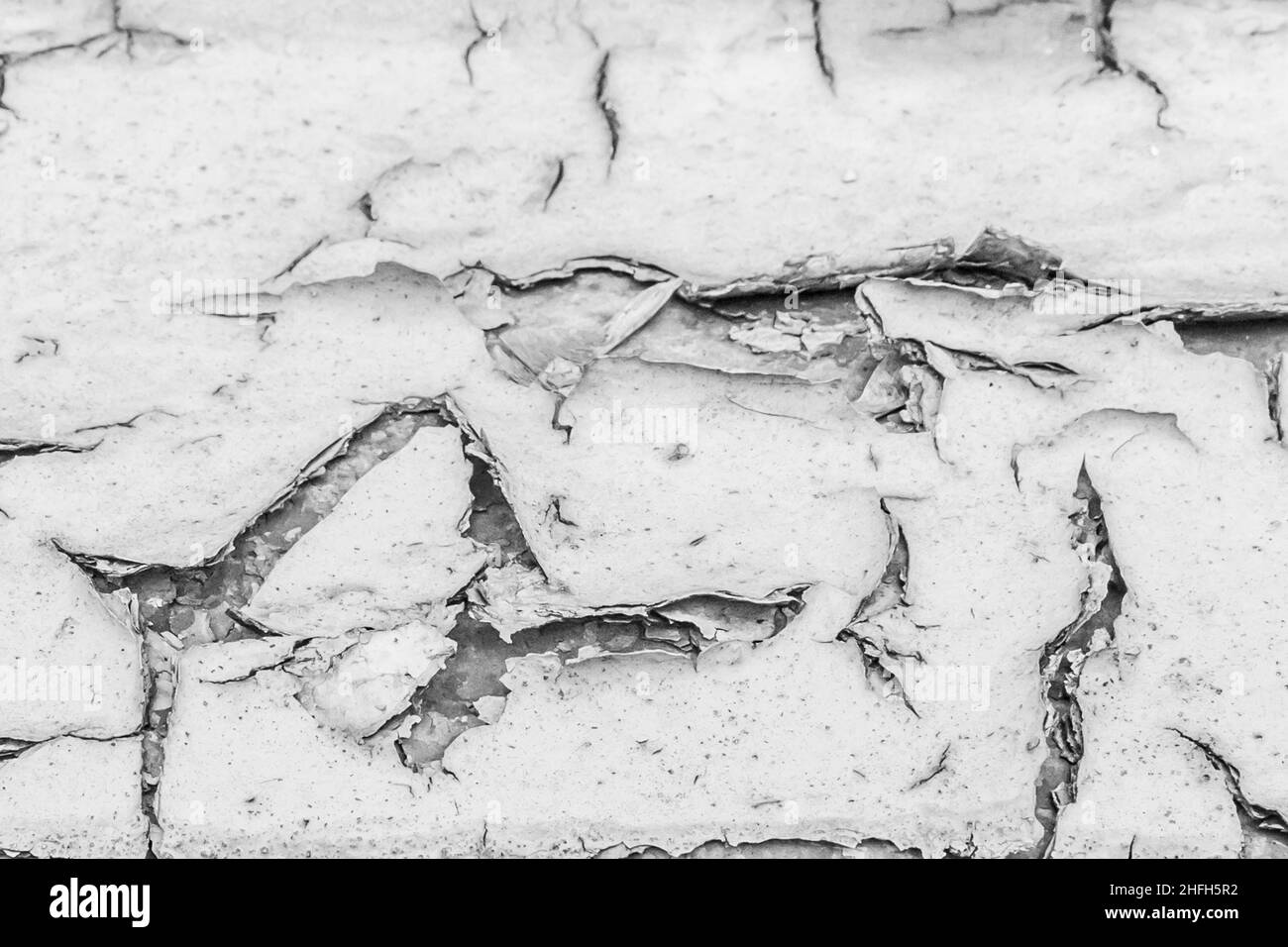 Cracked white paint on old weathered surface texture abstract ...