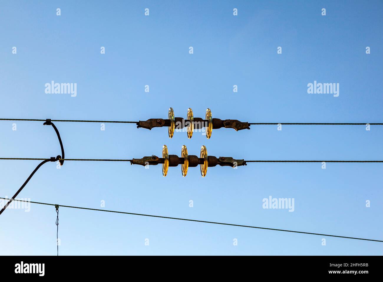 Railroad overhead lines against clear blue sky, Contact wire Stock ...