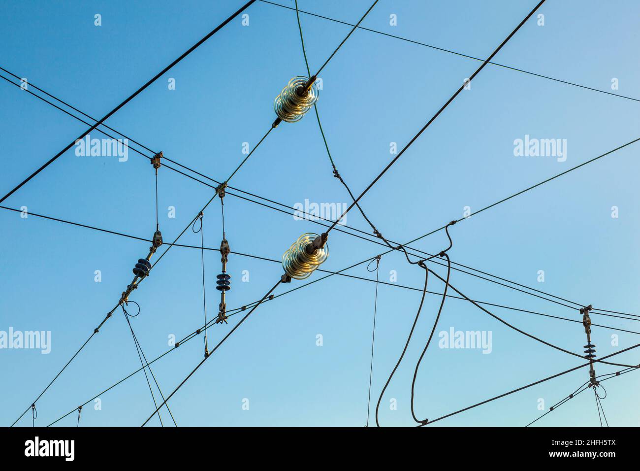 Railroad overhead lines against clear blue sky, Contact wire Stock ...