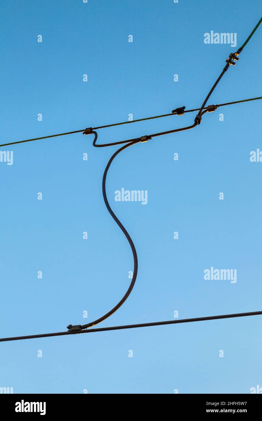 Railroad overhead lines against clear blue sky, Contact wire Stock ...