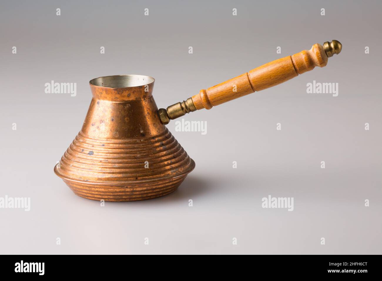 Copper Cezve for coffee brewing. Isolated on a gray background Stock ...