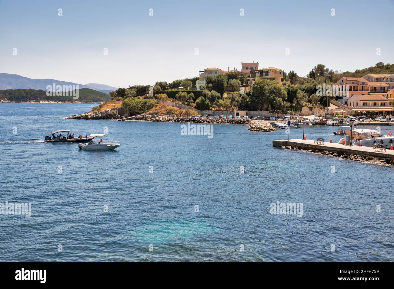 Kassiopi, Corfu, Greece - August 07, 2021: View over Kassiopi marina ...