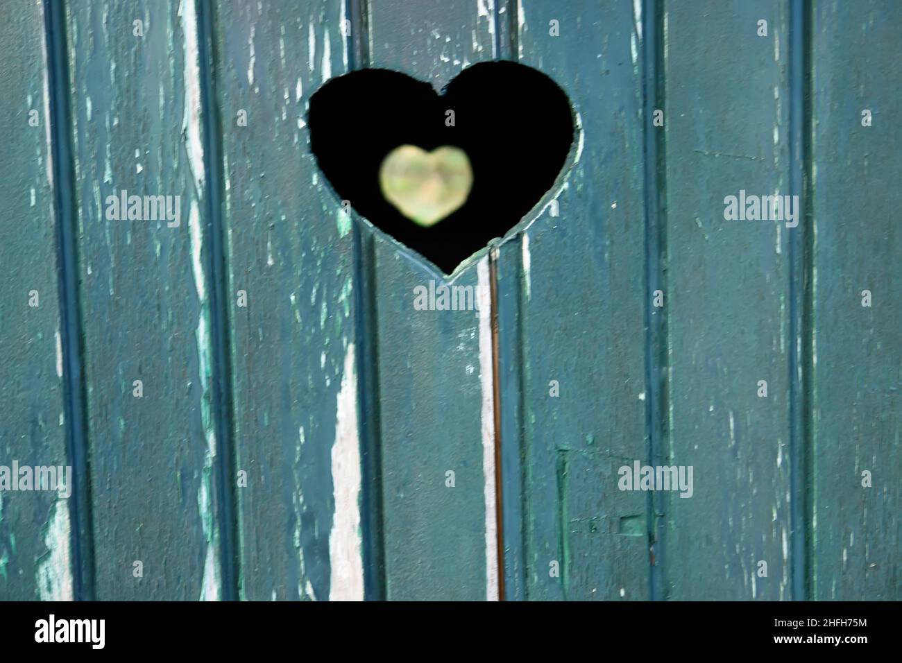 heart shape cut into wooden door Stock Photo - Alamy
