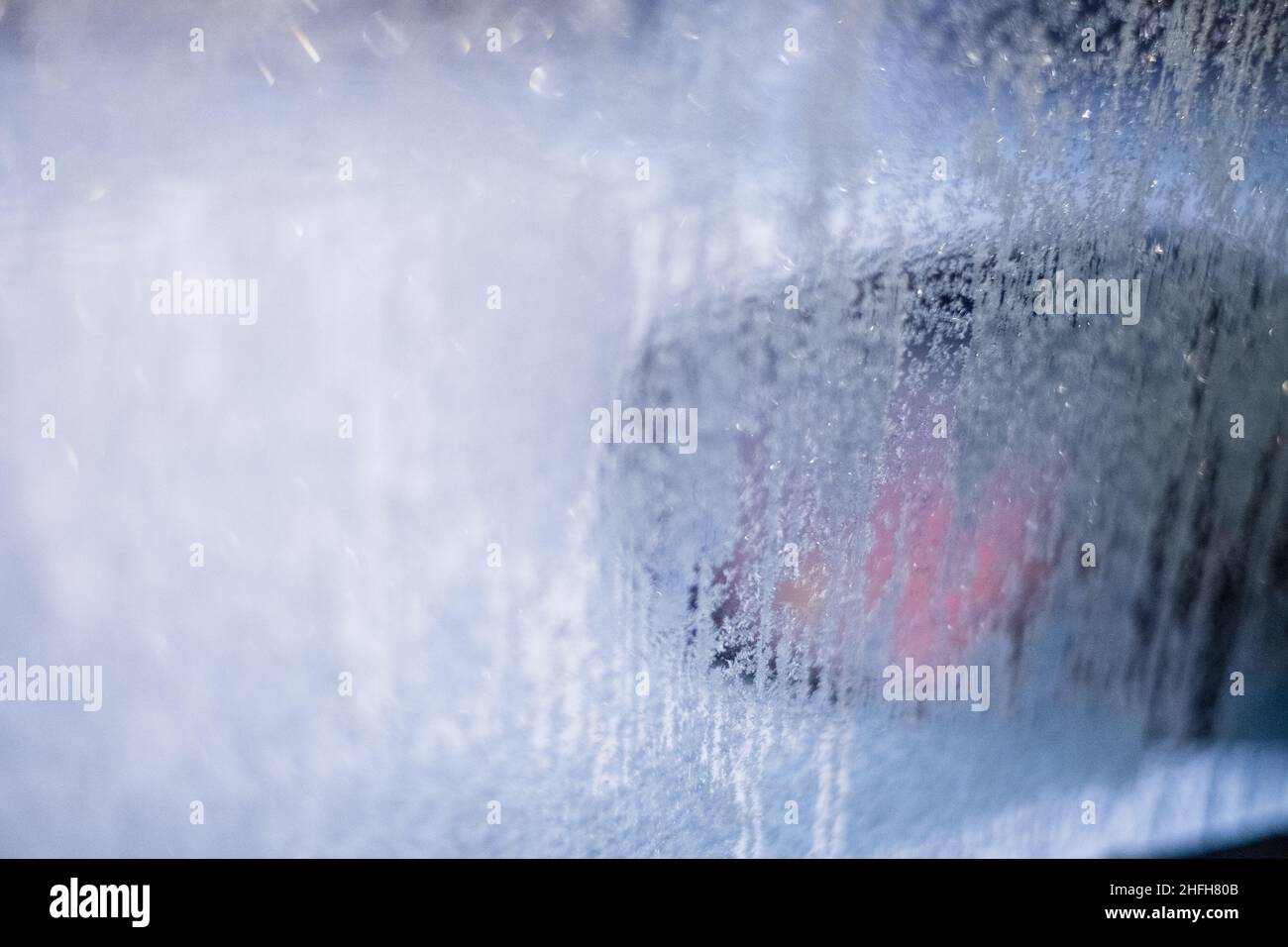 Car window under ice during cold winter weather. Dangerous traffic ...