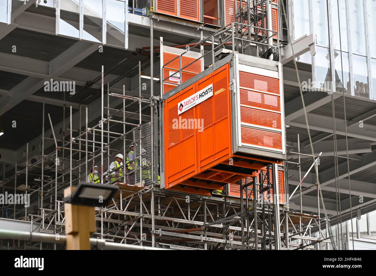 London, England - June 2020: Construction workers waiting to get into a ...