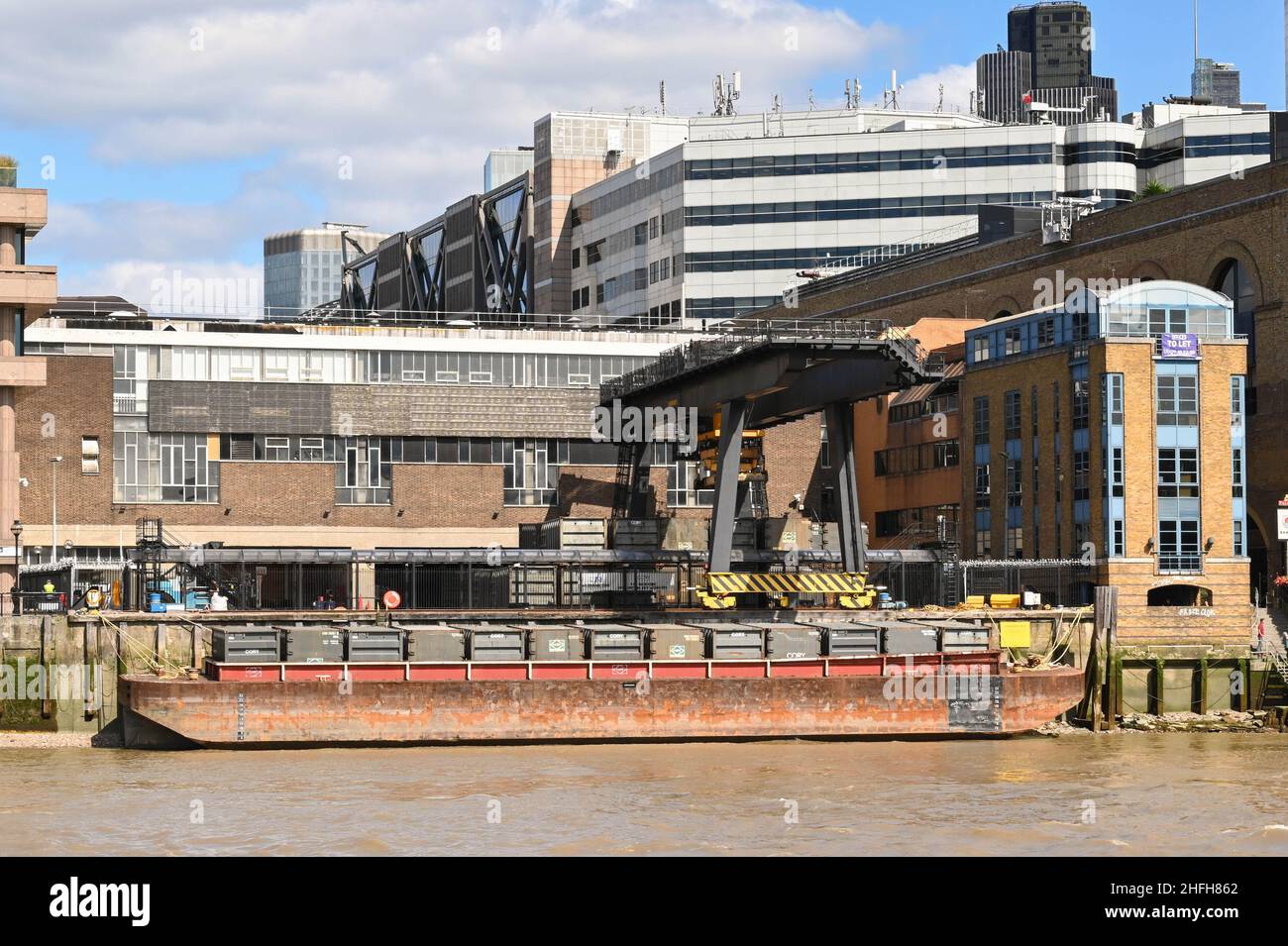 London, England - June 2020: River barge full of waste disposal ...