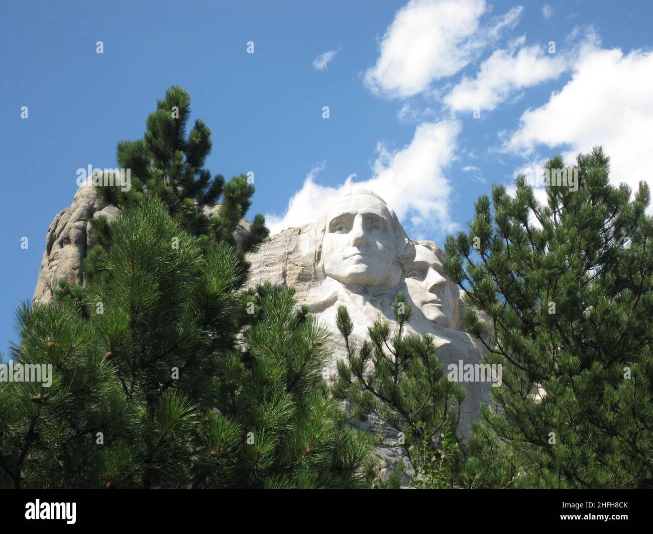George Washington face, through the trees, on Mount Rushmore Stock ...